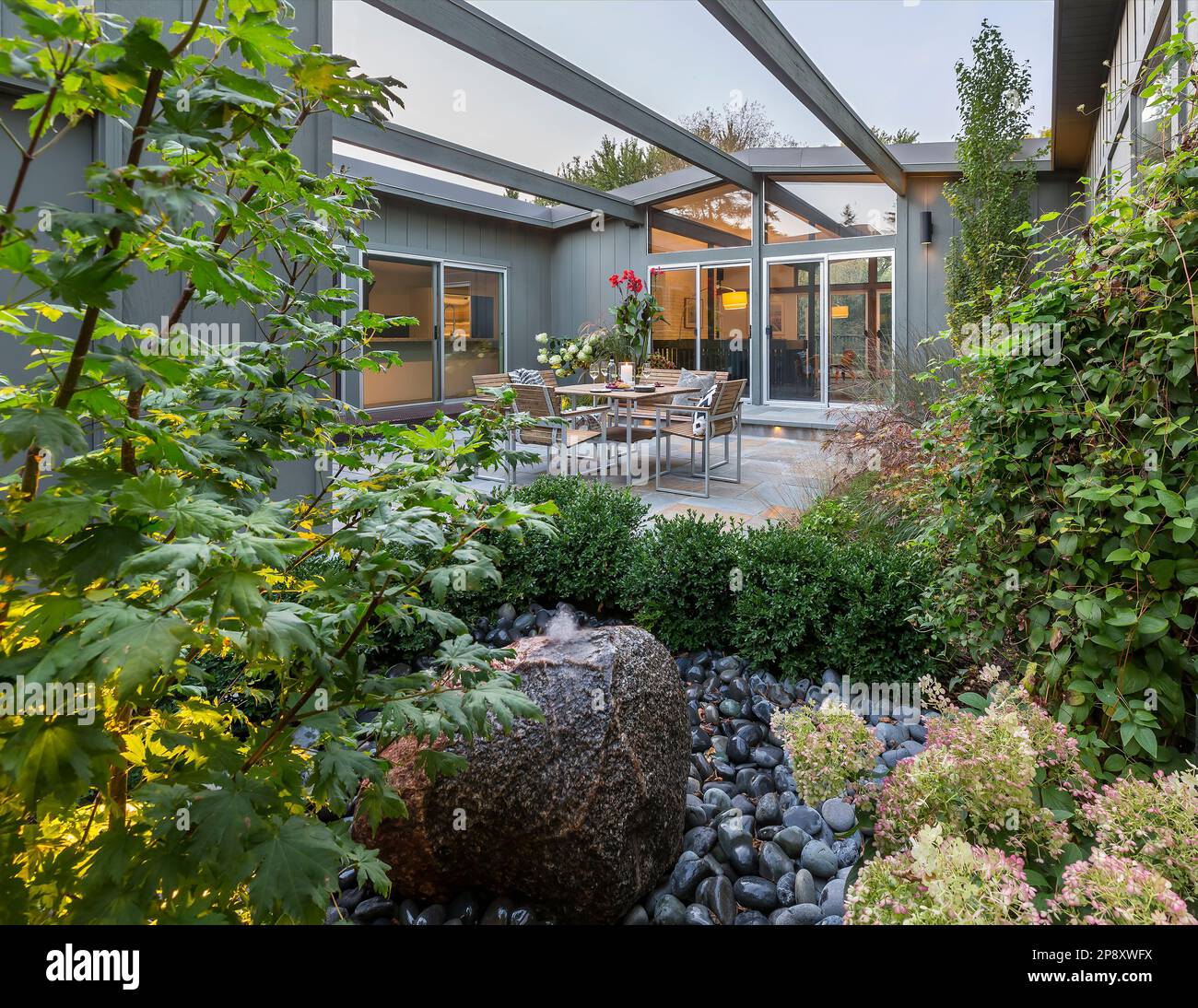A recently redone exterior courtyard of a mid-century modern house ...
