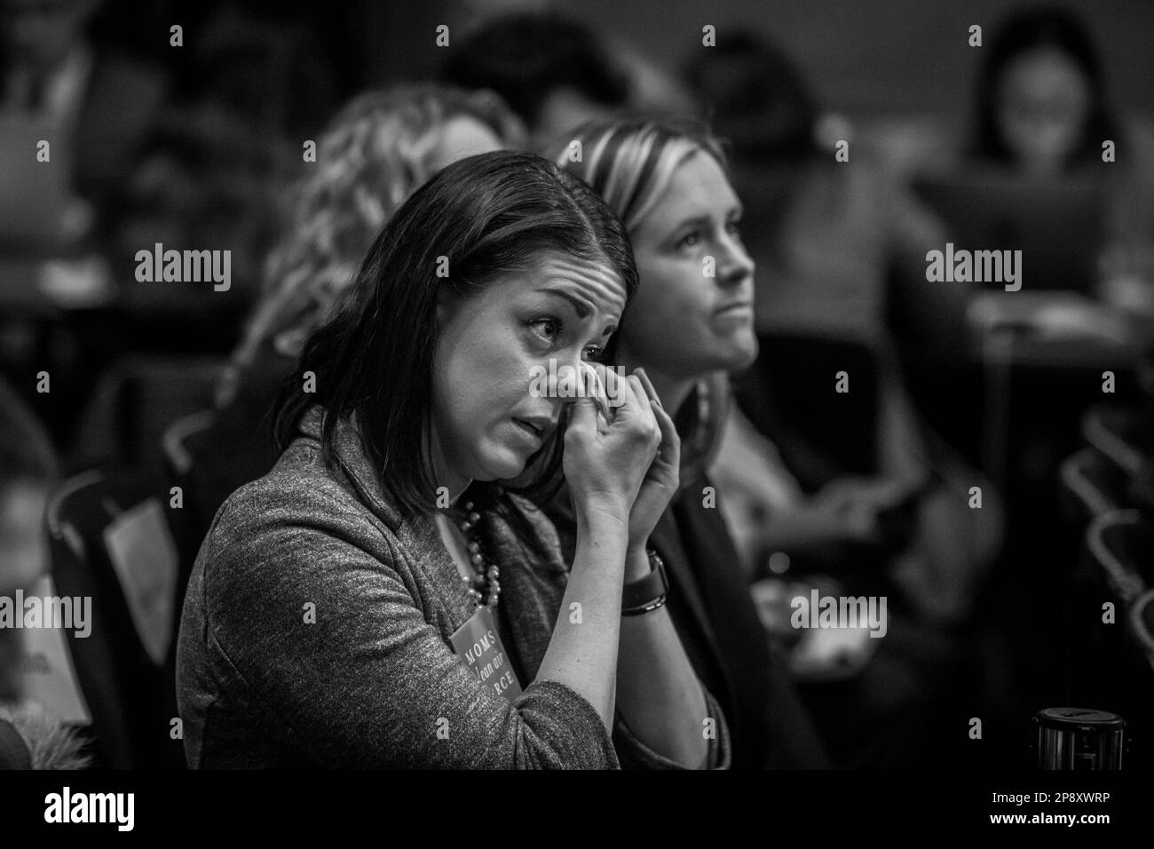 East Palestine, Ohio resident Misti Allison wipes tears from her eyes ...