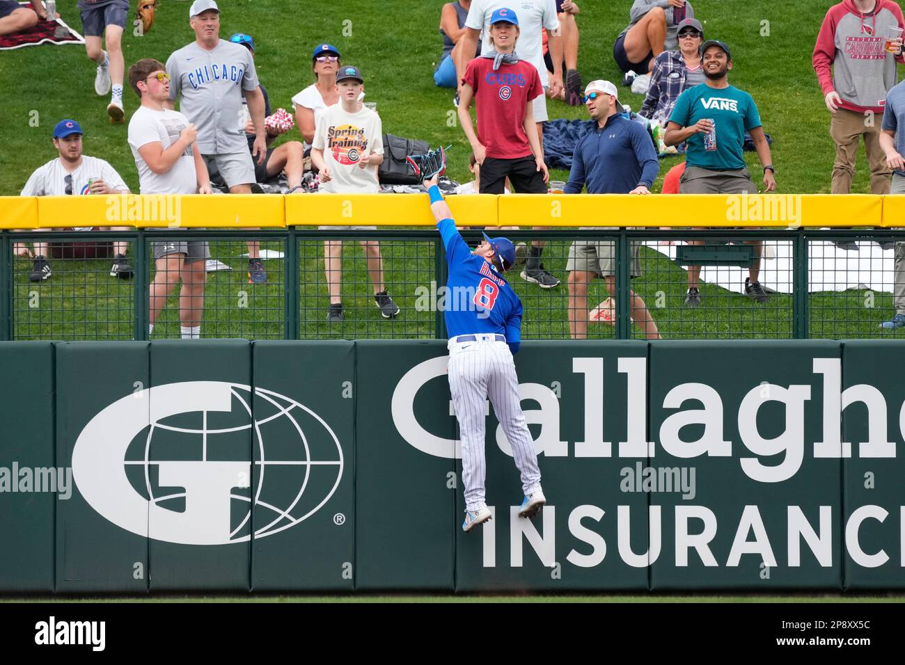 Chicago Cubs left fielder Ian Happ leaps in vain for a two-run home run ...