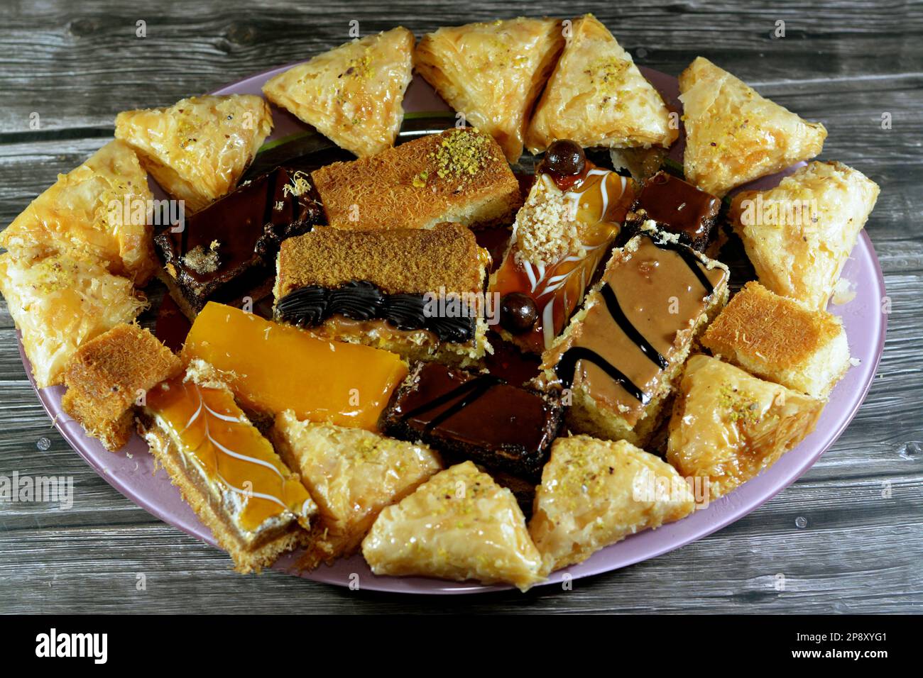 Eastern Ramadan desserts and pastries of Konafa covered with mango ...