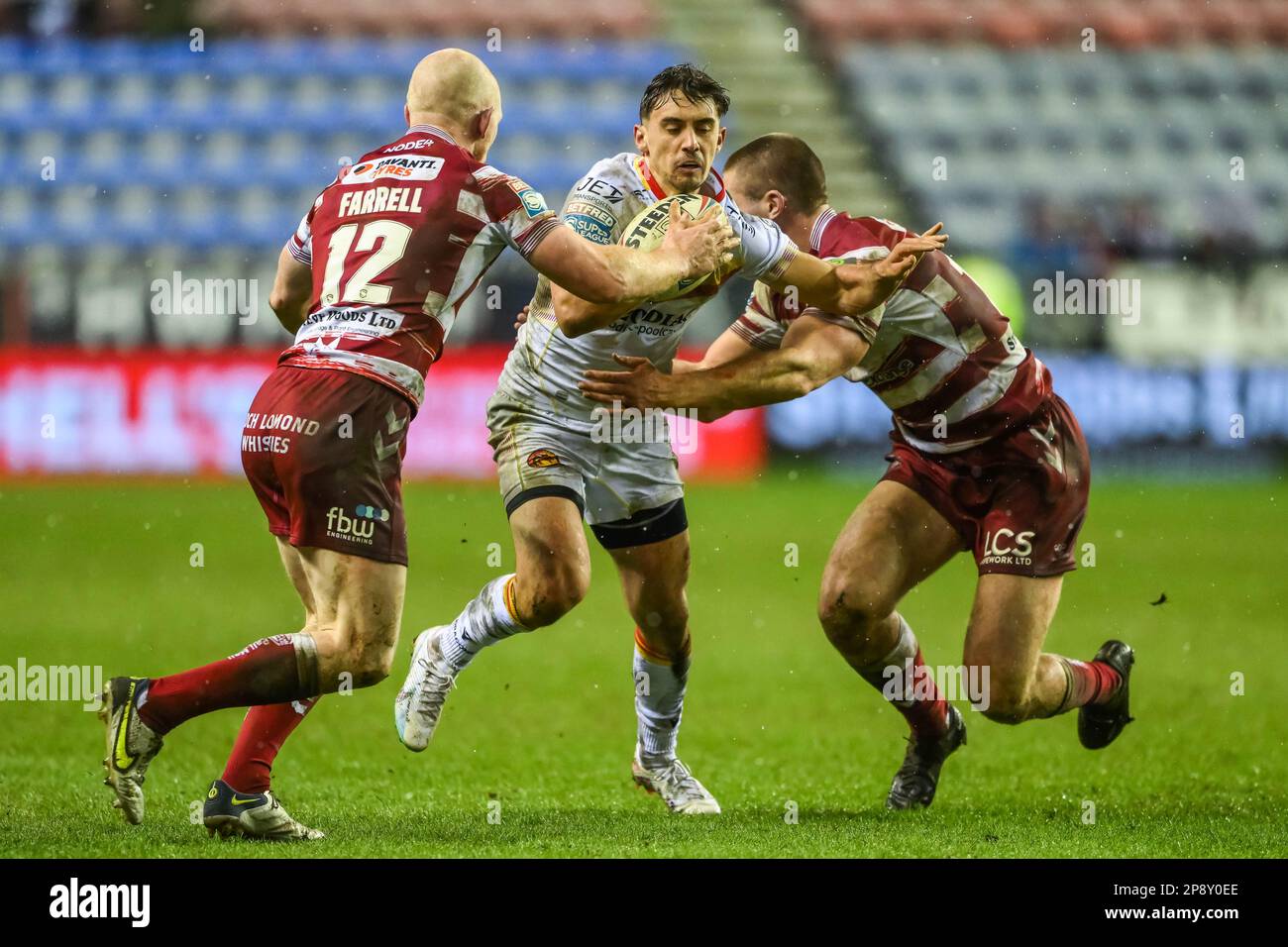 Arthur Mourgue #1 of Catalans Dragons is tackled by Ethan Havard #16 of ...