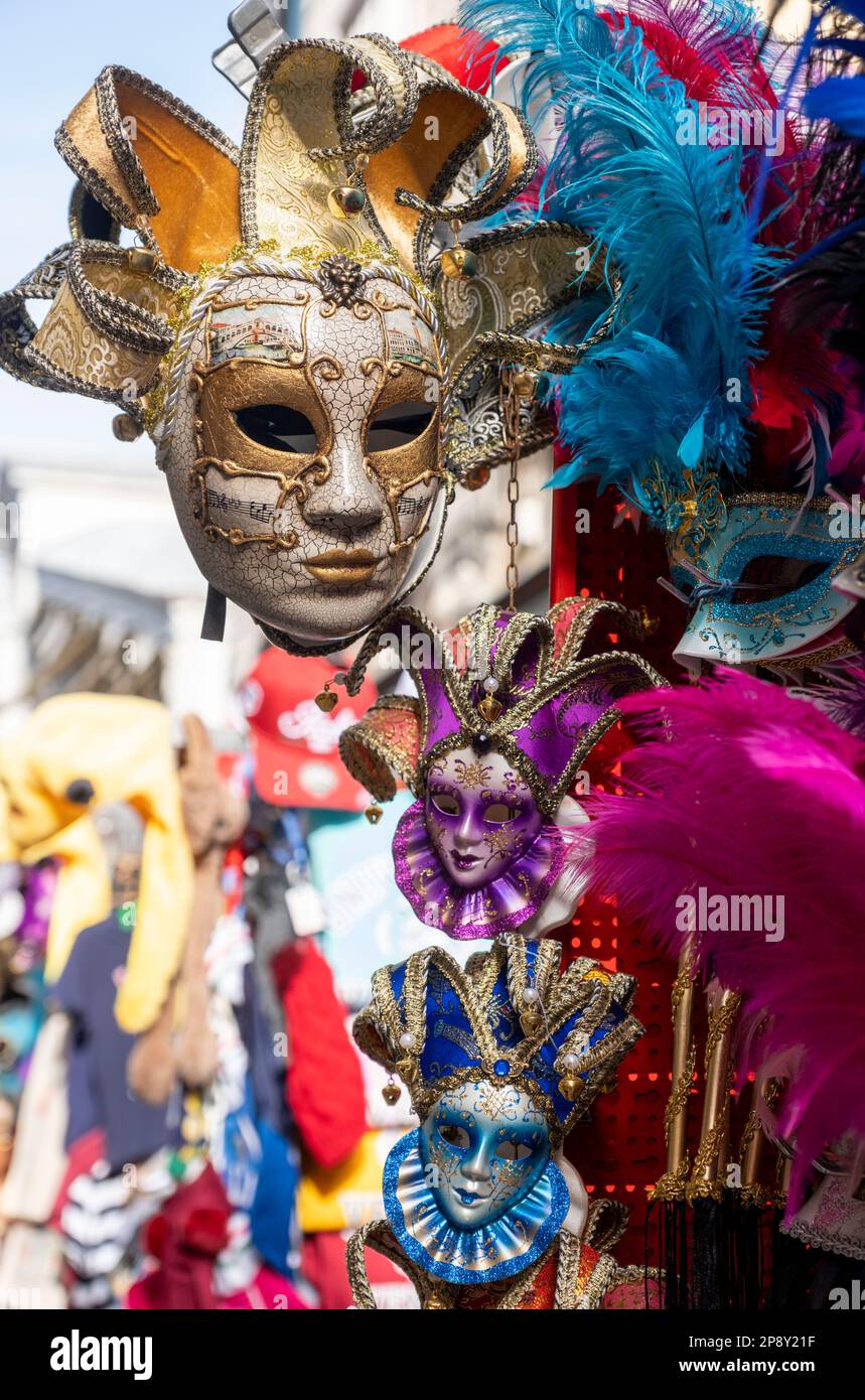 Face masks on display on a street venders stall, Venice, Italy Stock ...
