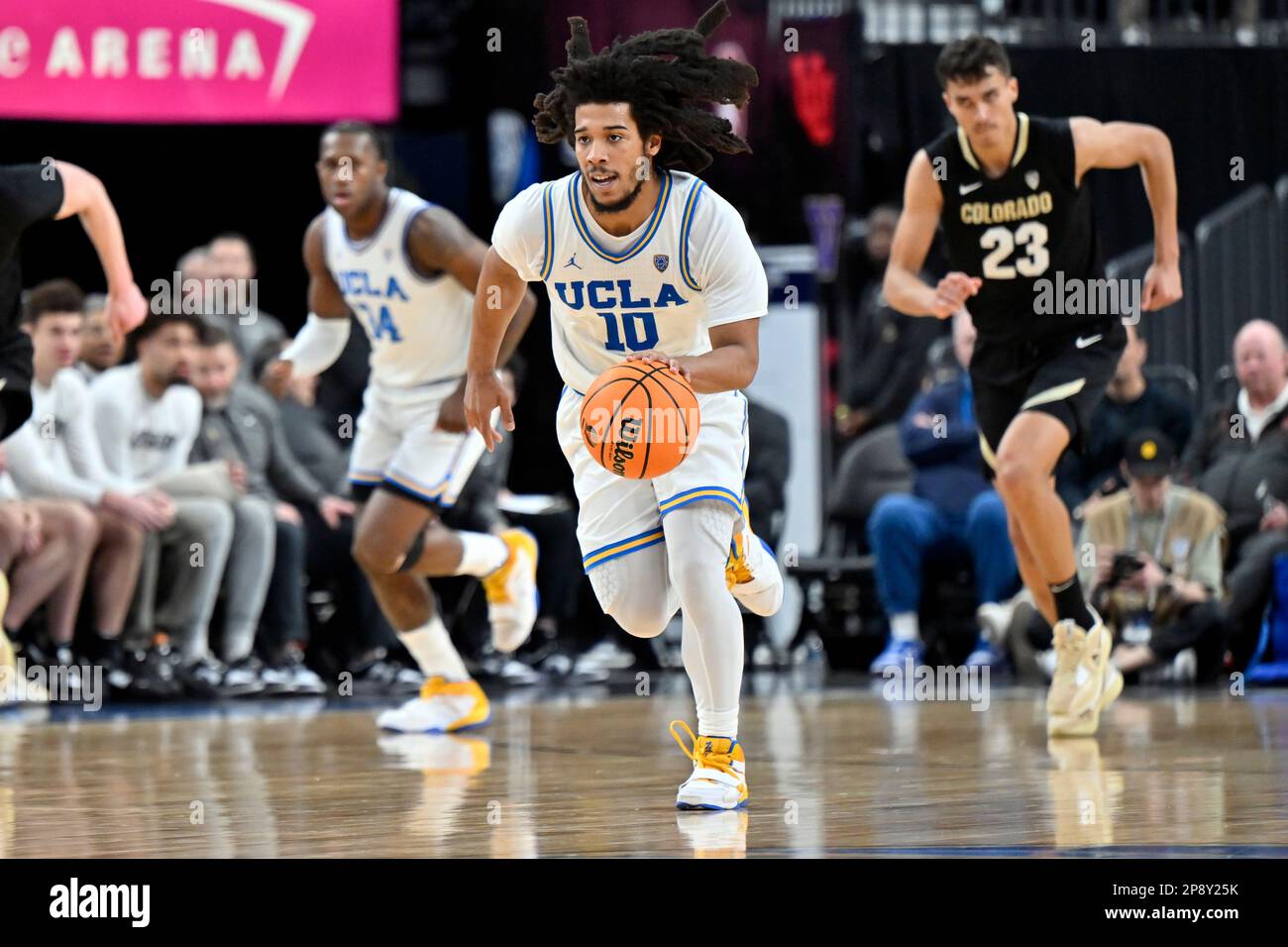 UCLA guard Tyger Campbell (10) brings the ball up court against ...
