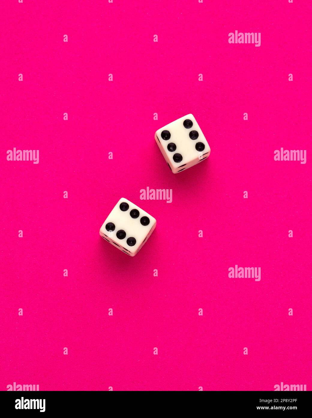 Pair of dice for board game - Rhodamine red eva rubber background Stock ...