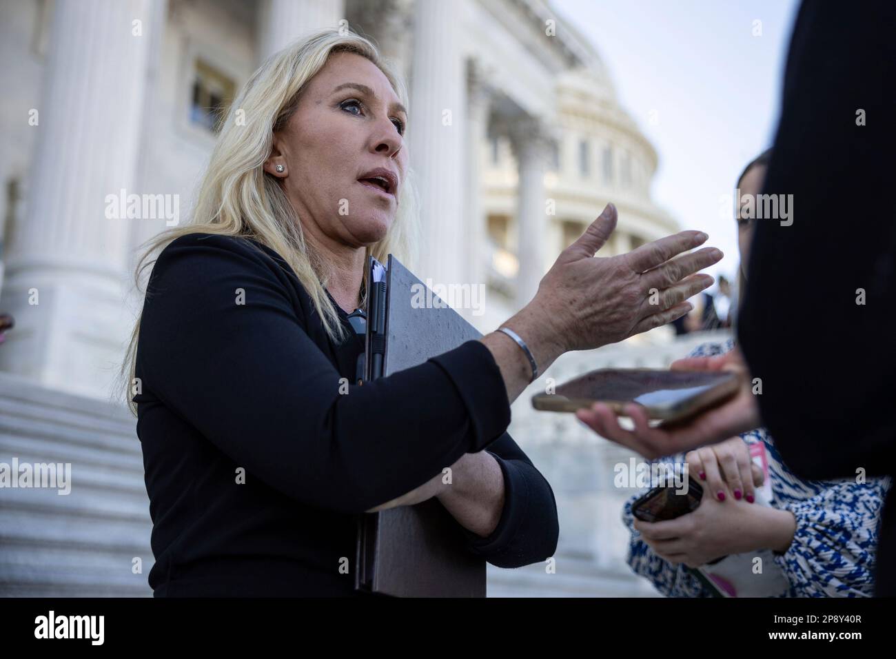 Rep. Marjorie Taylor Greene (R-Ga.) speaks with reporters as she ...