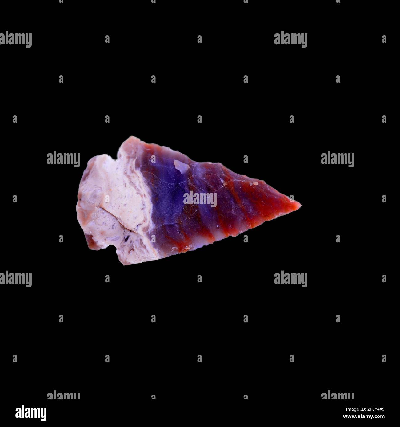 Handmade stone flint Arrow point isolated over a black background Stock ...