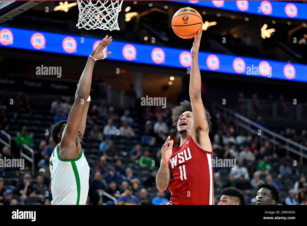 Washington State forward DJ Rodman (11) shoots over Oregon center N ...