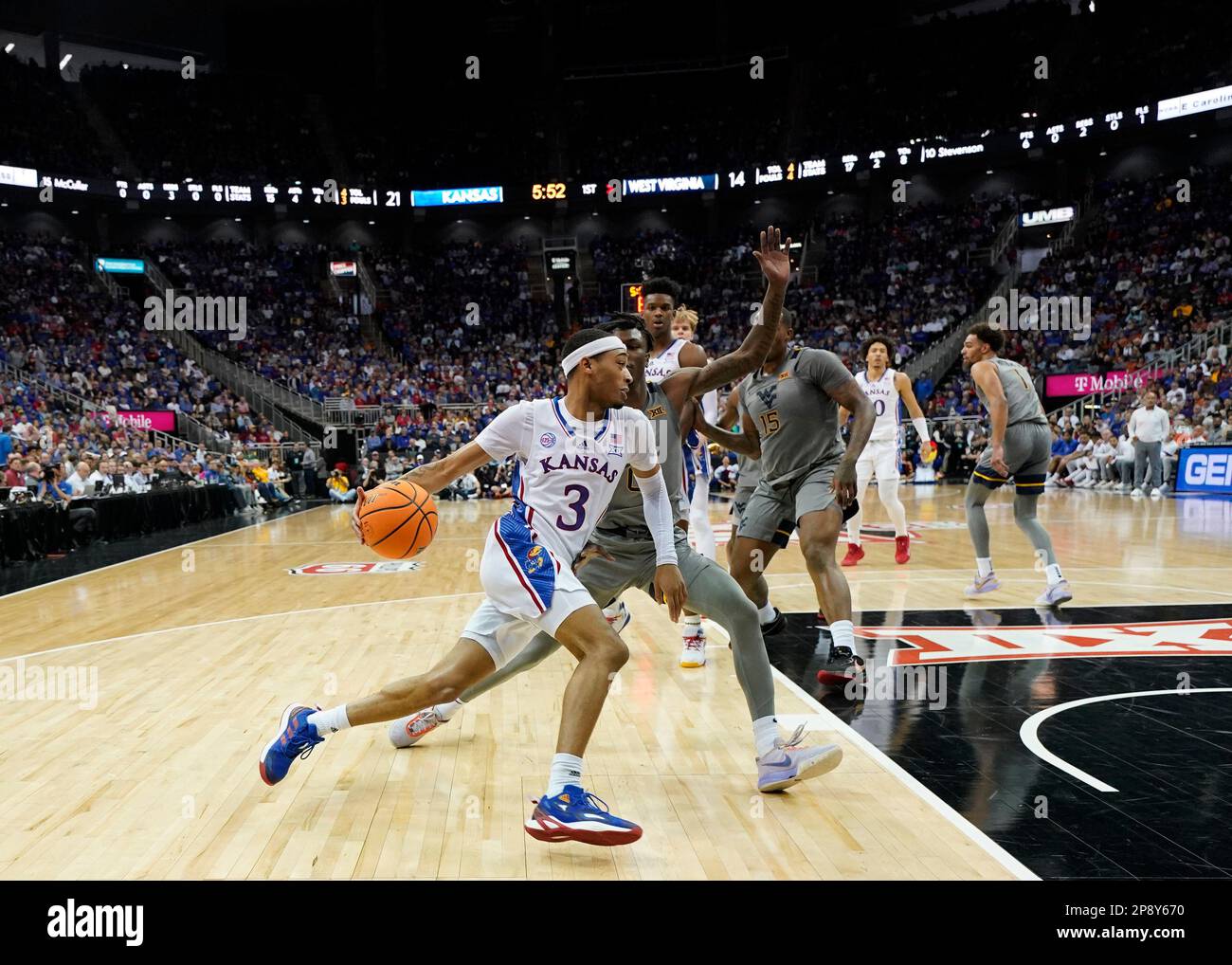 MAR 09 2023: Kansas guard Dajuan Harris Jr. (3) drives to the basket ...