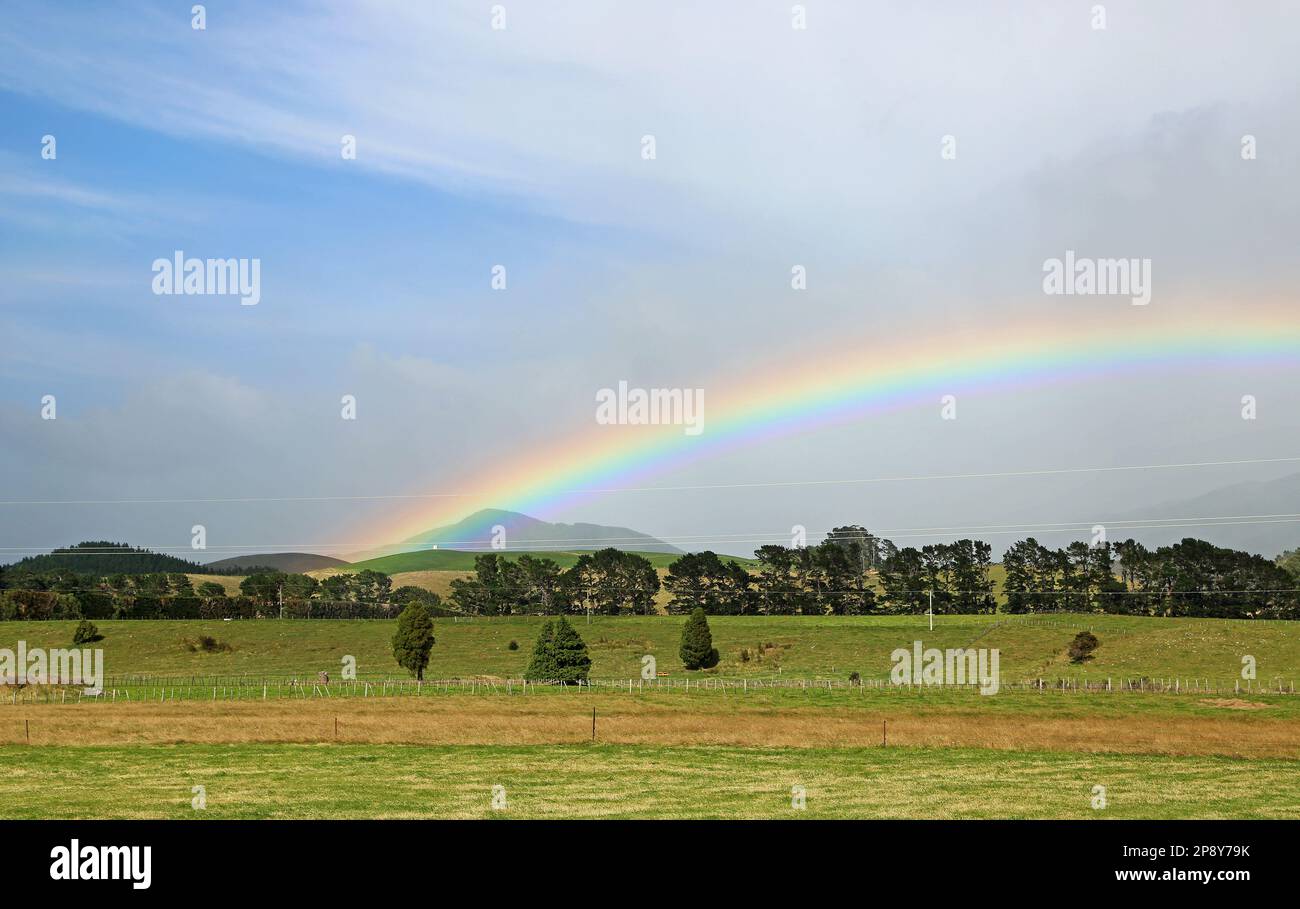 The rainbow over pasture, New Zealand Stock Photo - Alamy