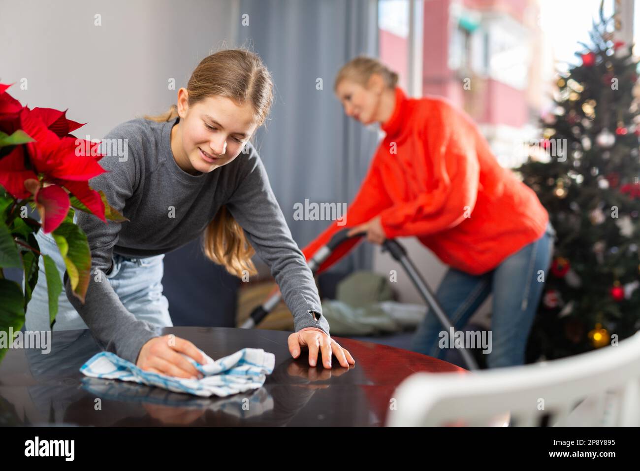 Daughter helps mother clean hi-res stock photography and images - Alamy