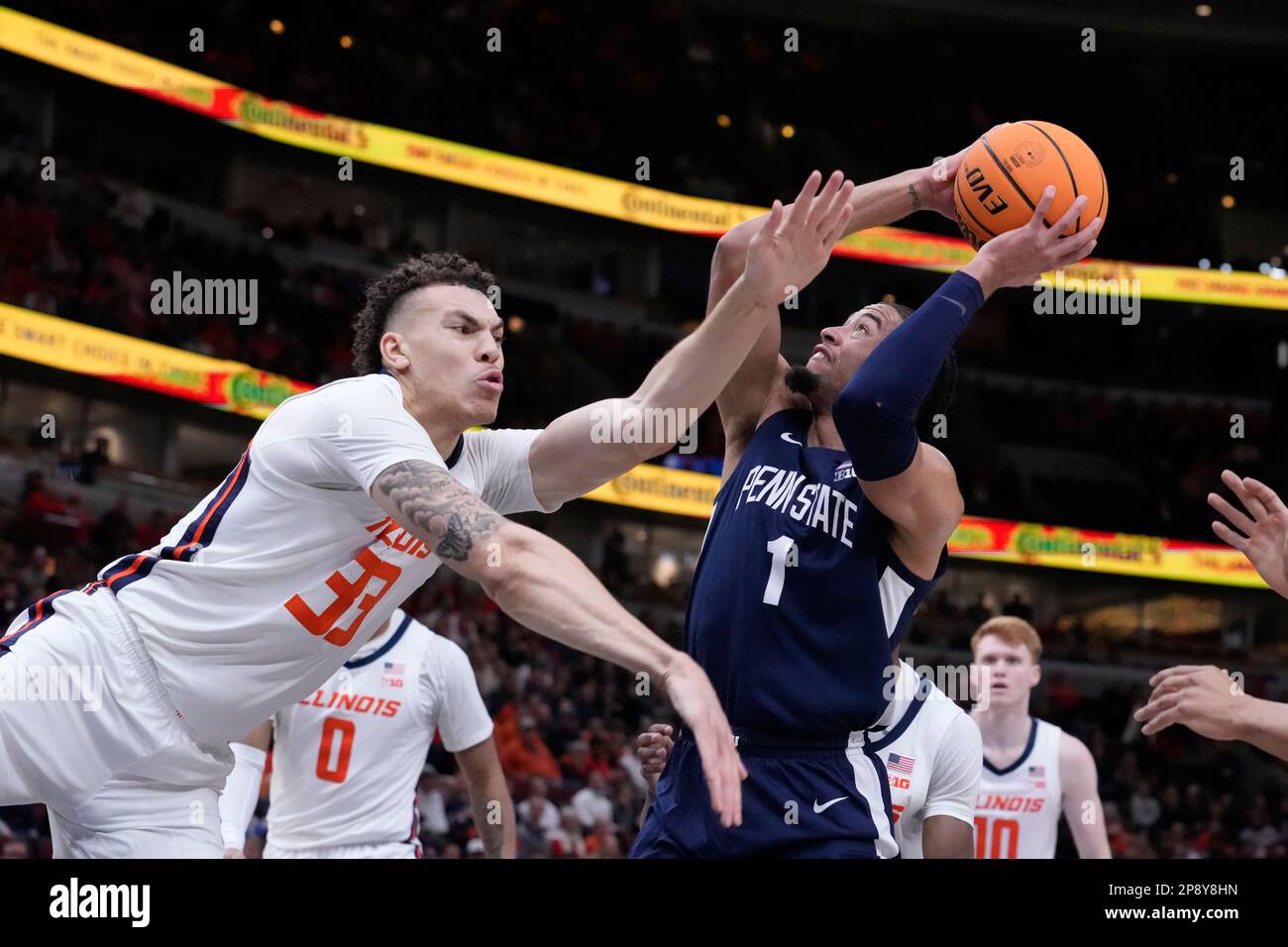 Penn State's Seth Lundy eyes the basket as Illinois's Coleman Hawkins ...
