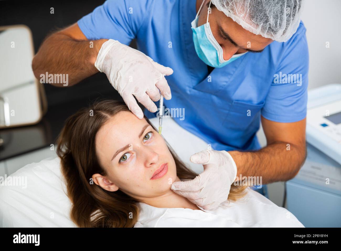 Female patient receiving injections for face skin tightening Stock ...