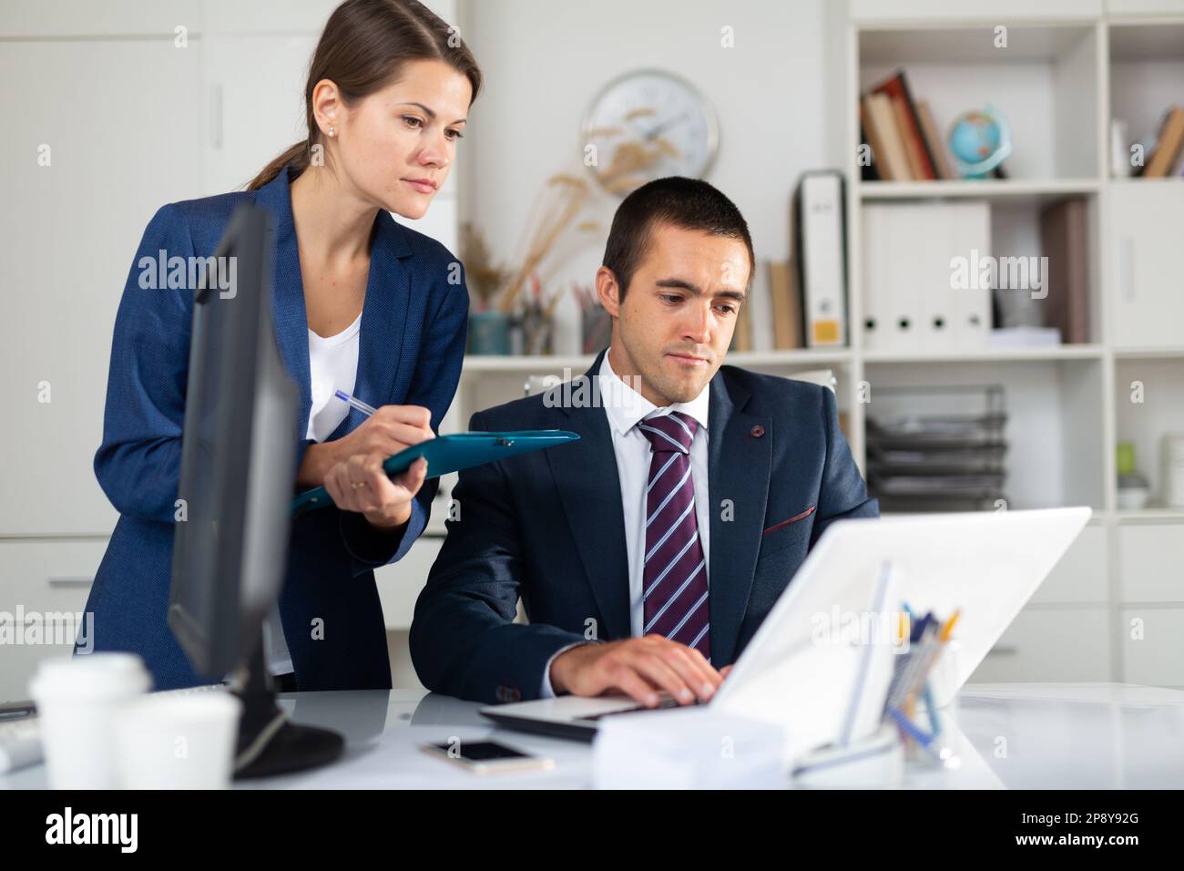 Directors assistant makes daily routine and writes down instructions in ...