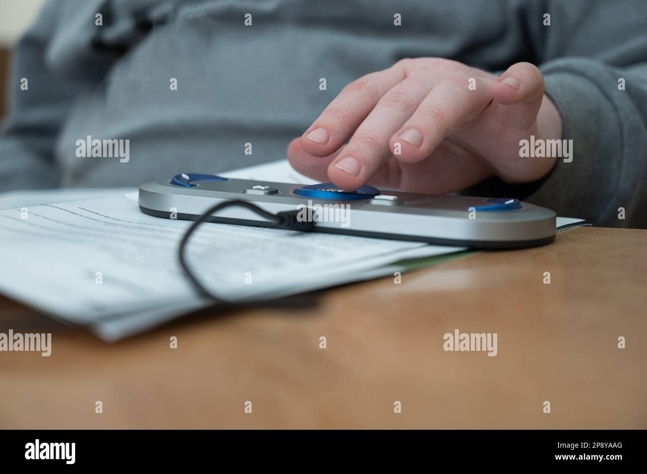 A visually impaired man uses a scanning and reading machine Stock Photo ...