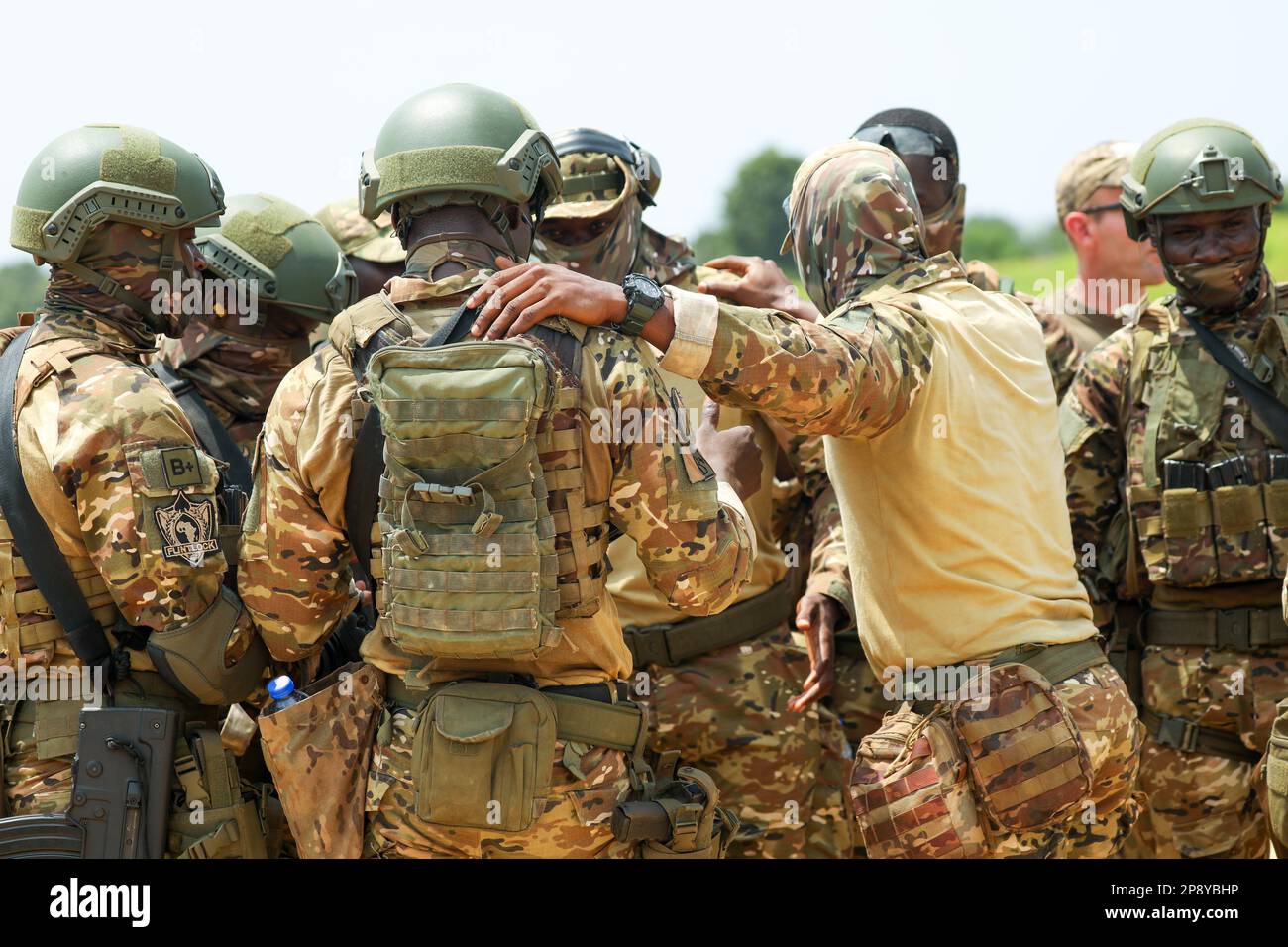 Ivorian Soldiers come together after a shooting competition during ...