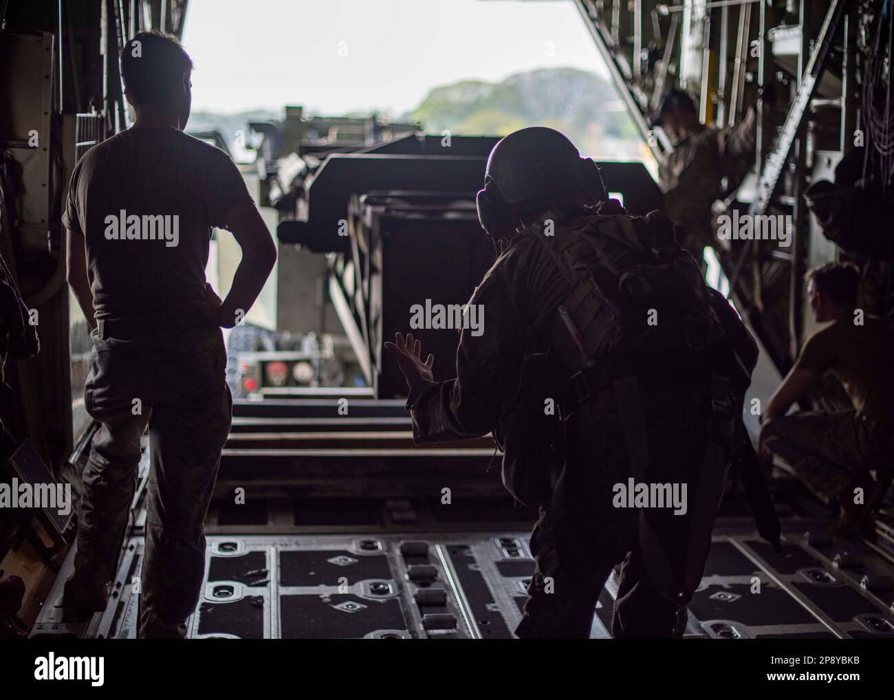 A U.S. Marine and 353rd Special Operations Wing loadmasters prepare to ...