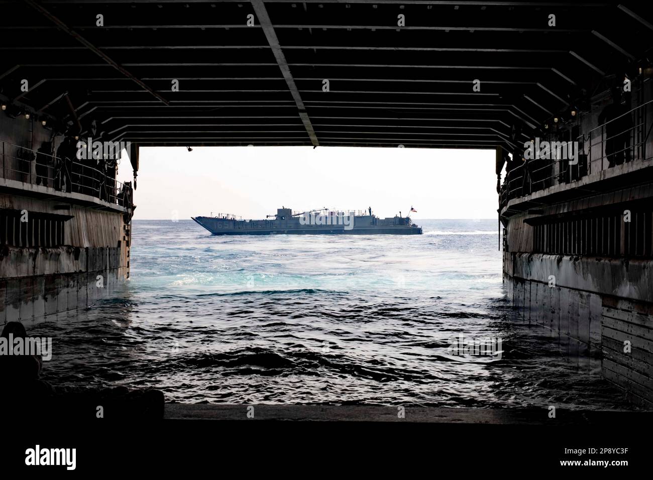 A U.S. Navy landing craft utility disembarks from the amphibious dock ...