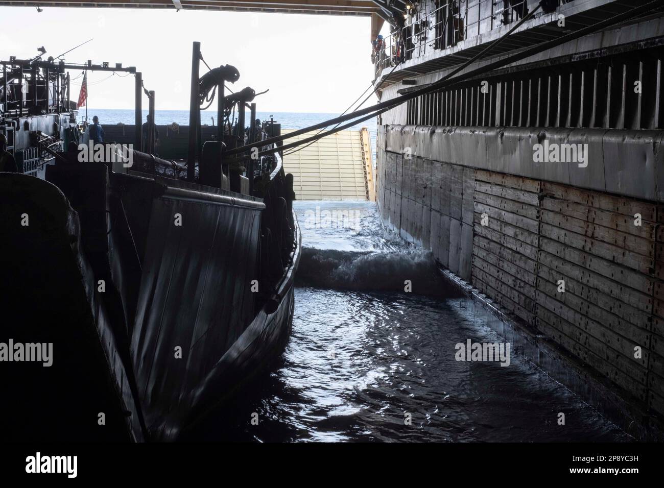 U.S. Navy Sailors aboard the amphibious dock landing ship USS Ashland ...