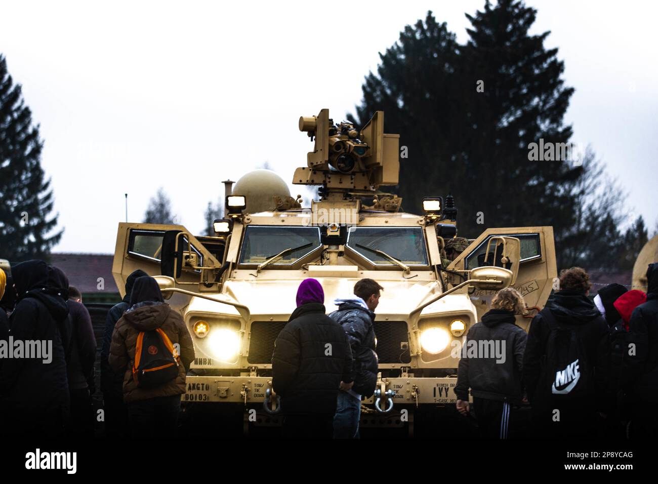 Polish students stand before a U.S. Army mine-resistant, ambush ...