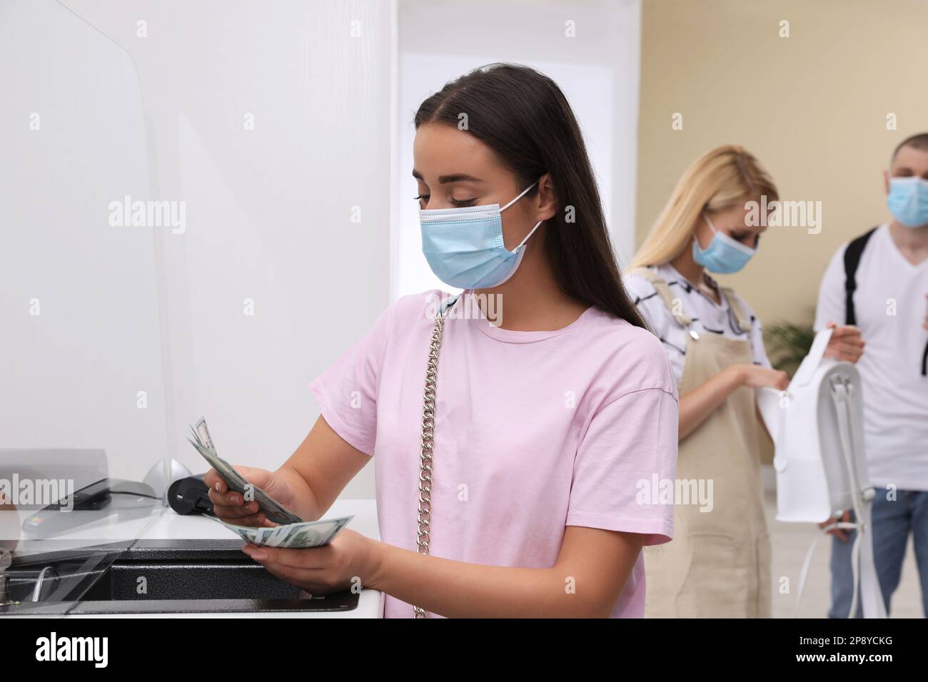 Woman counting cash in counter hi-res stock photography and images - Alamy