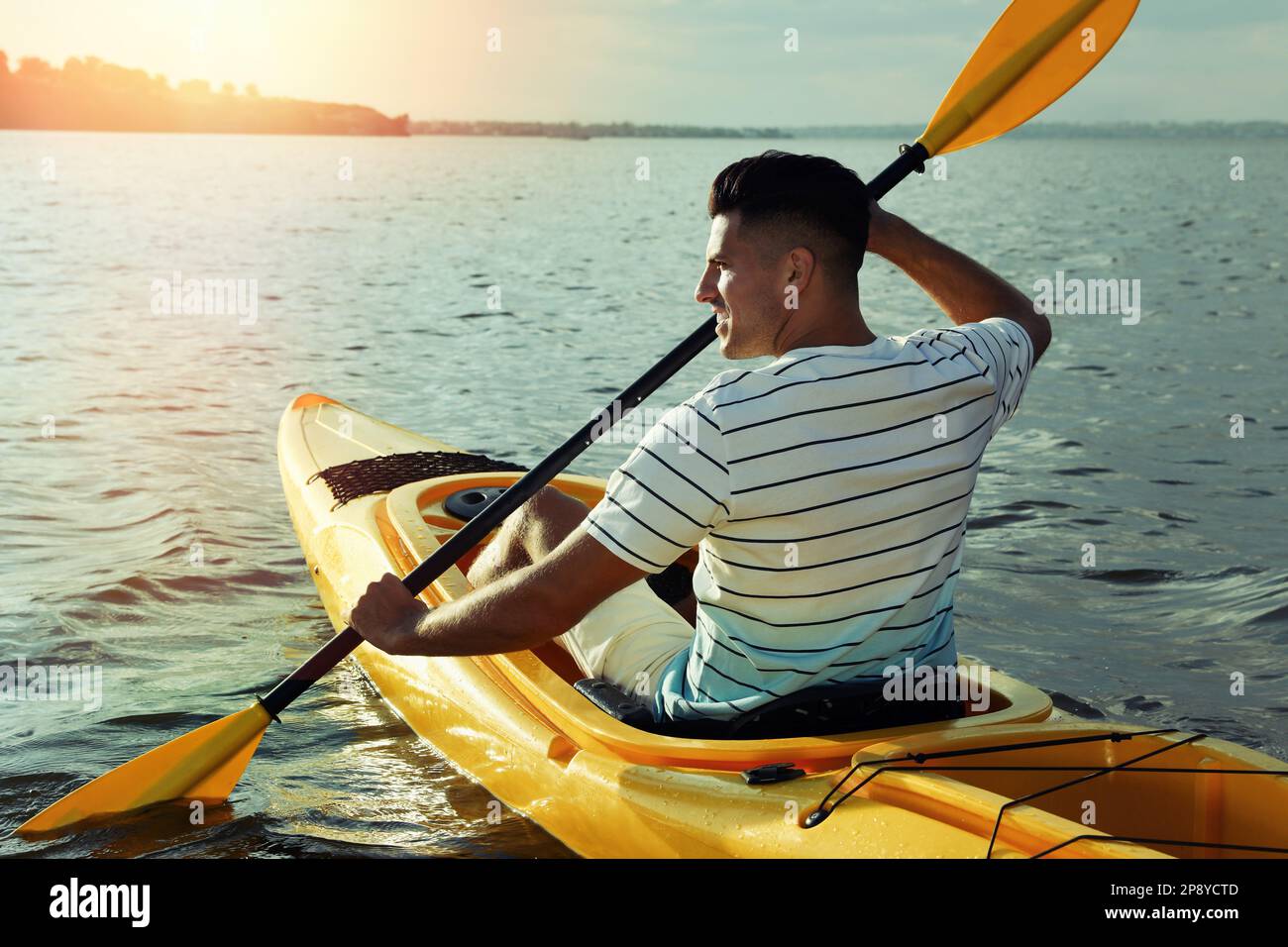 Happy man kayaking on river, back view. Summer activity Stock Photo - Alamy