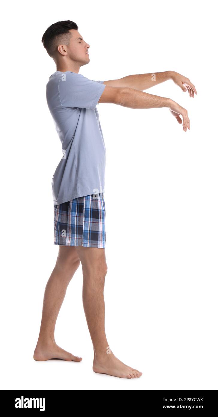 Somnambulist in pajamas on white background. Sleepwalking Stock Photo ...