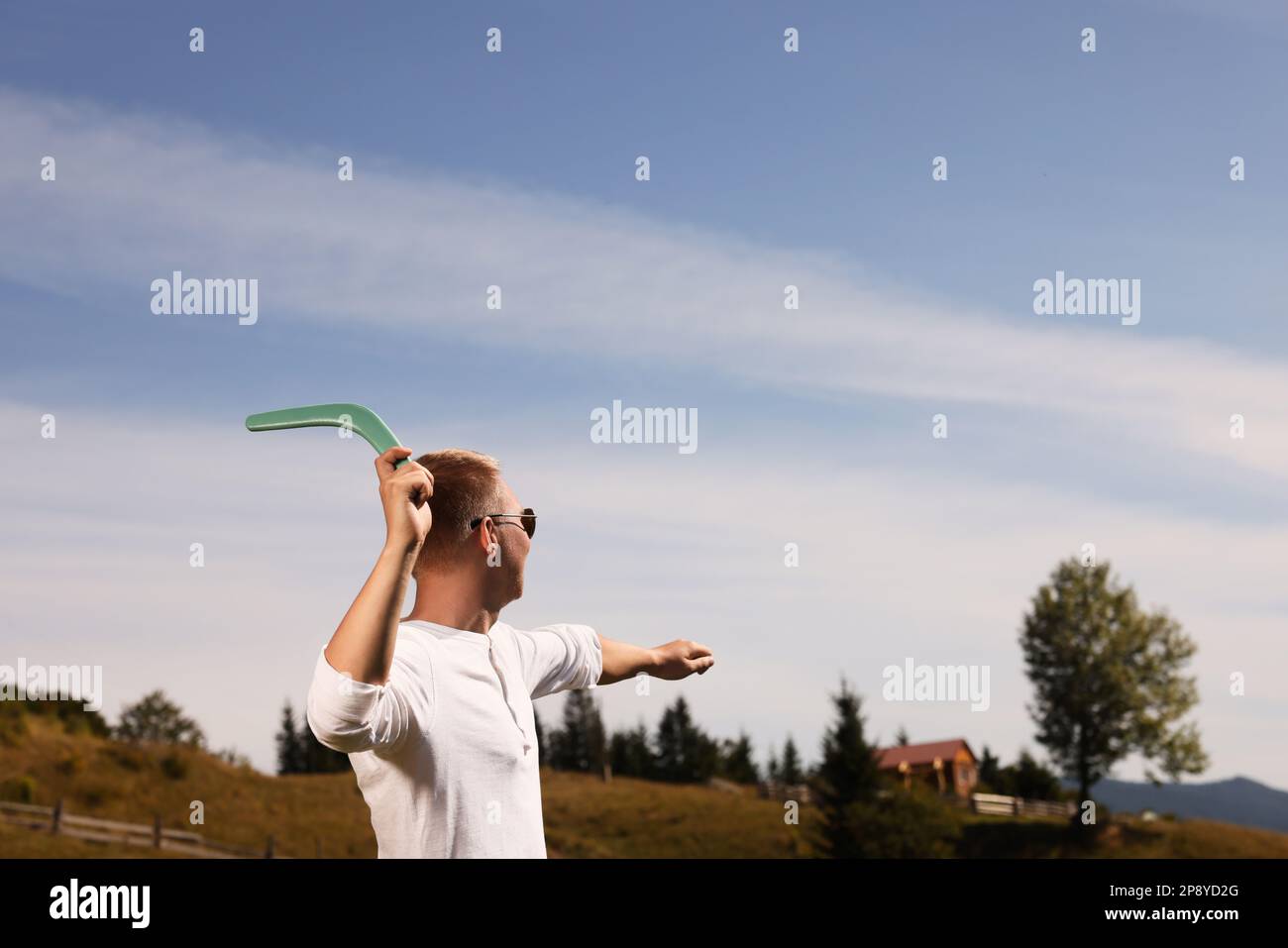 Young man throw boomerang hi-res stock photography and images - Alamy