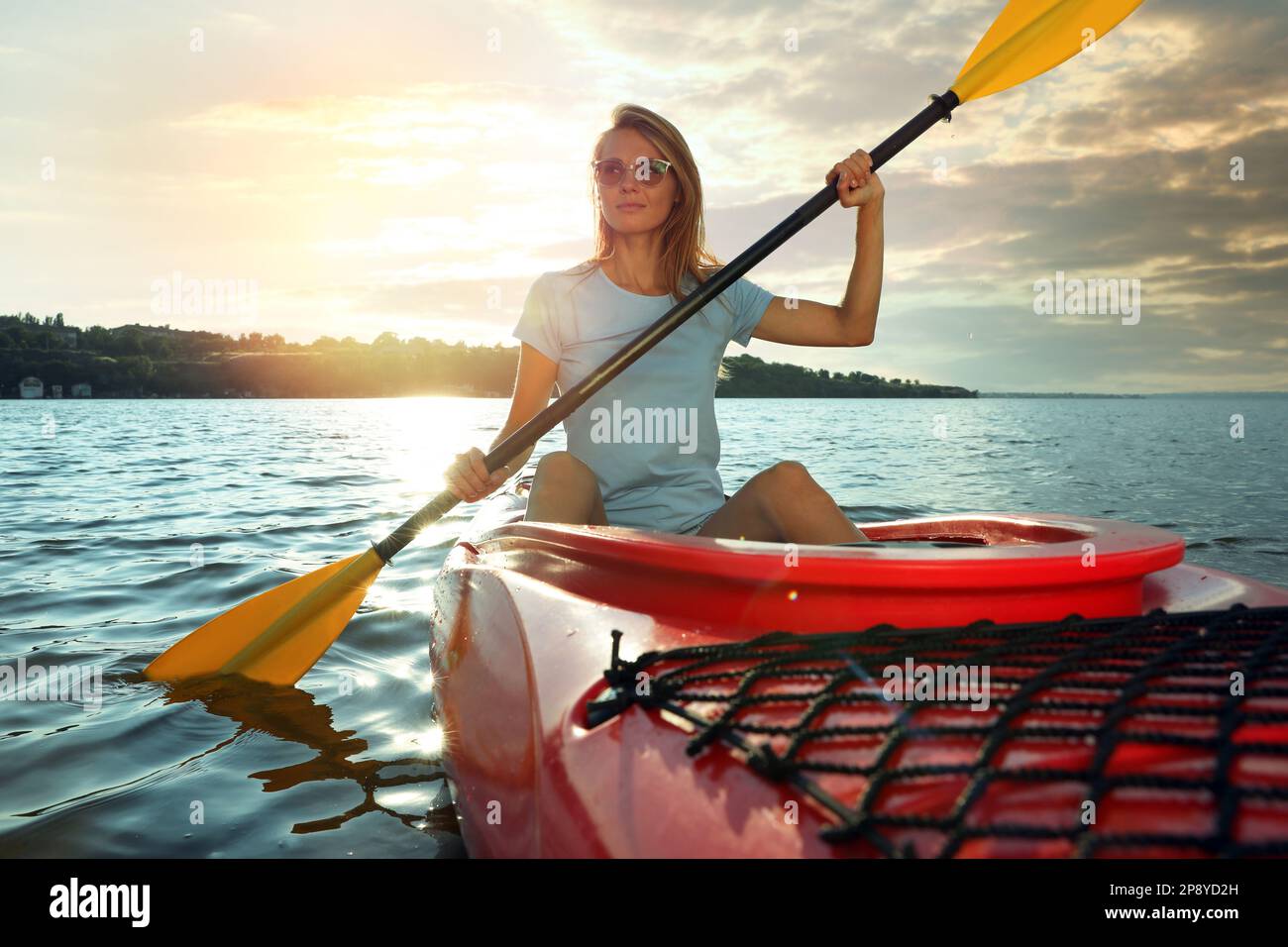 Beautiful woman kayaking on river. Summer activity Stock Photo - Alamy