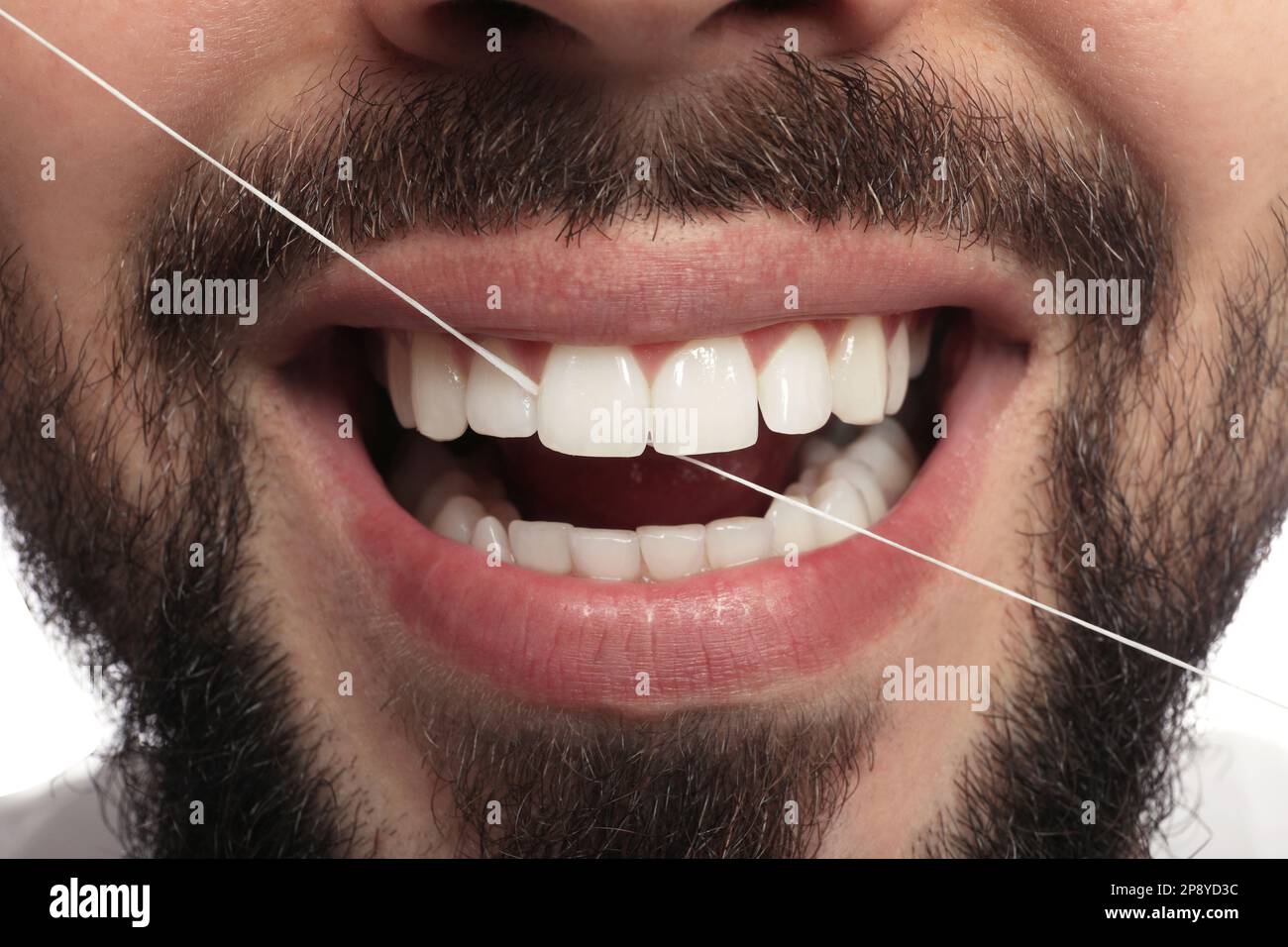 Man flossing his teeth on white background, closeup. Dental care Stock Photo - Alamy