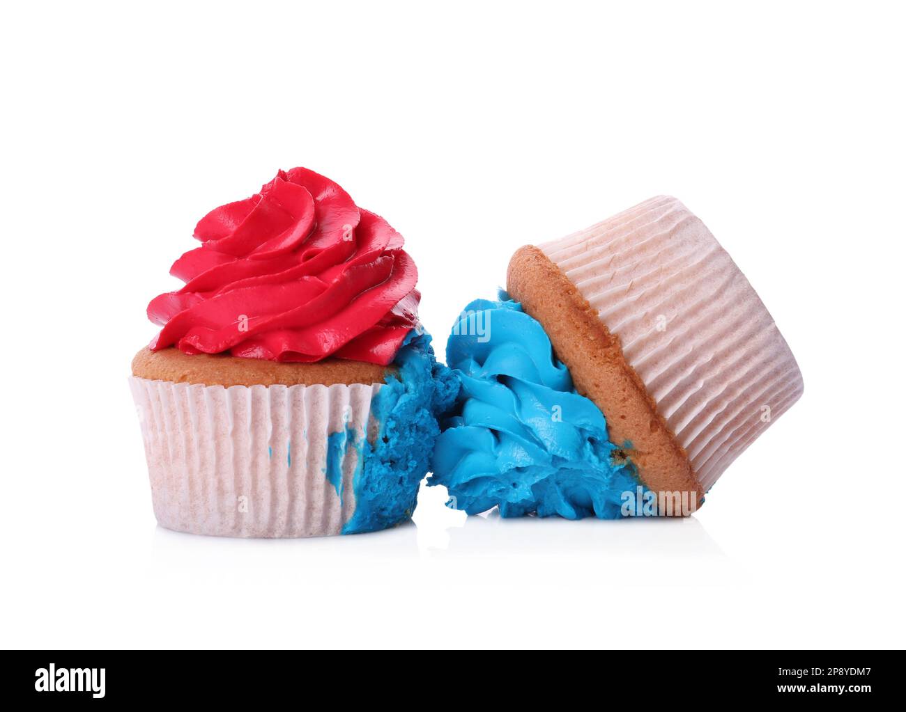 Two failed cupcakes with cream on white background. Troubles happen ...