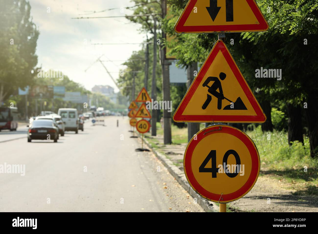 Traffic signs on city street. Road repair Stock Photo - Alamy