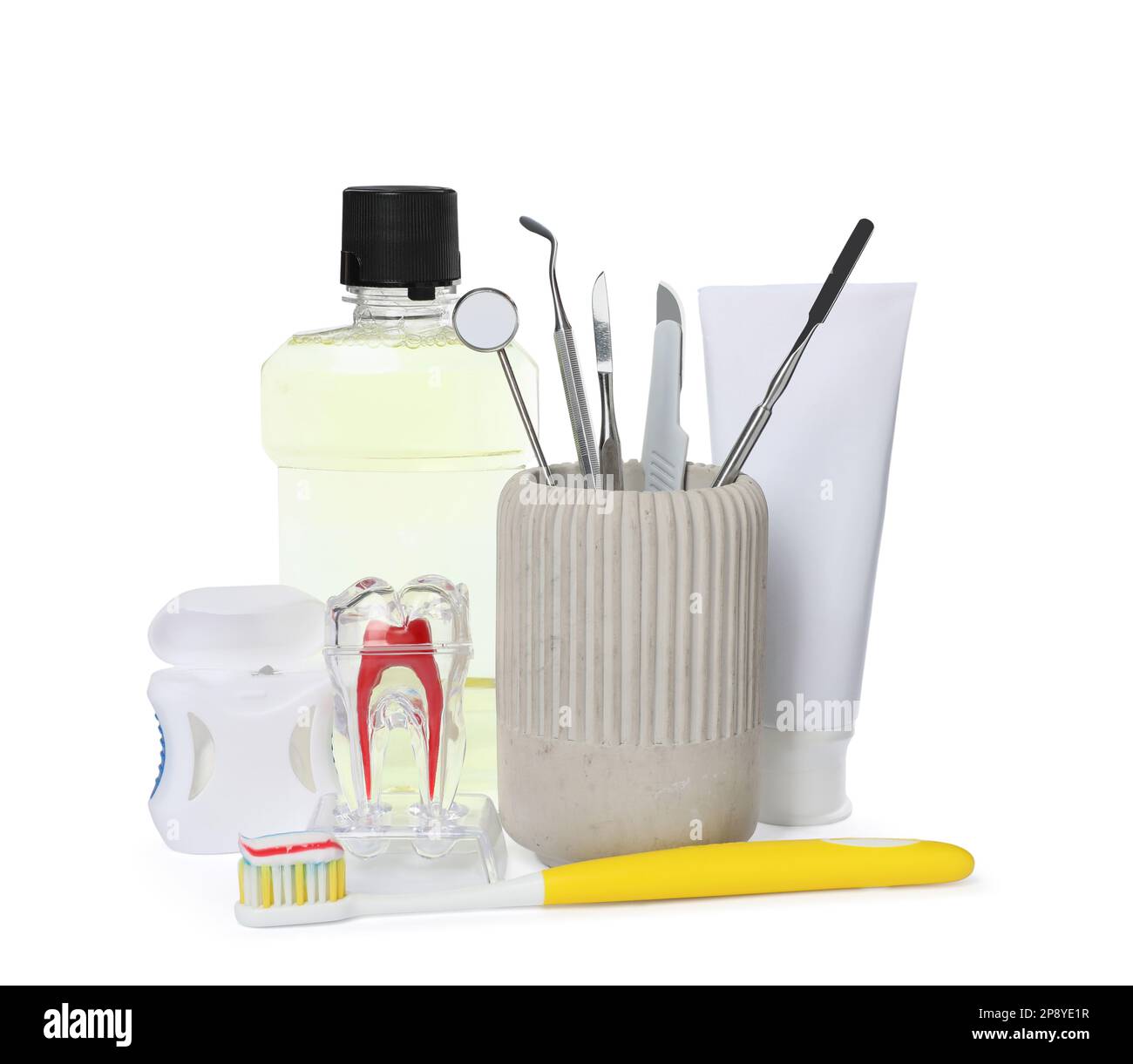 Tooth model, oral hygiene products and dentist tools on white ...