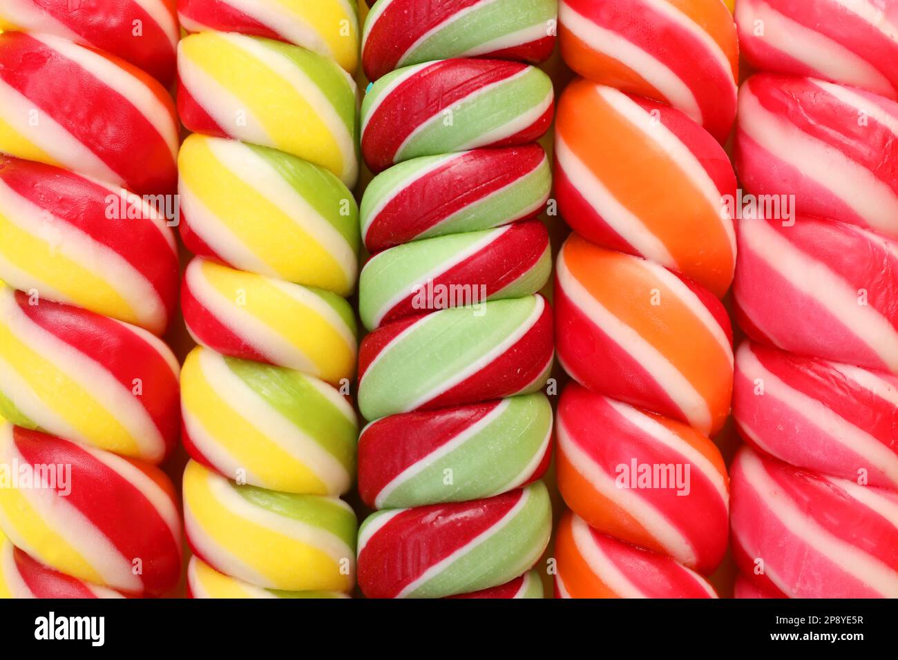 Many delicious colorful lollipops as background, closeup Stock Photo ...