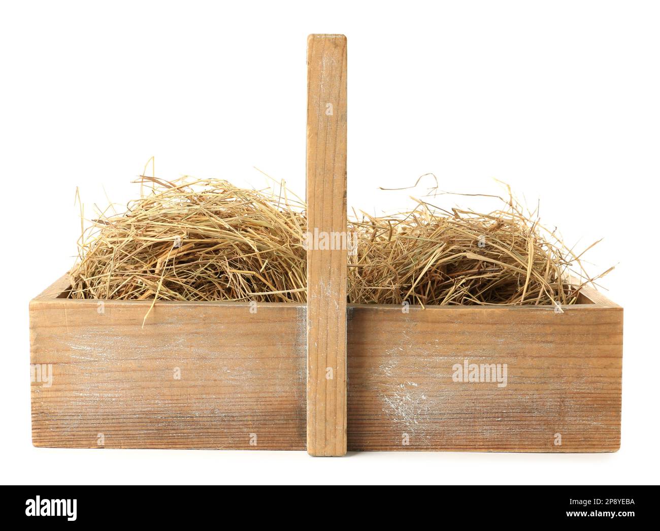 Dried hay in wooden basket on white background Stock Photo - Alamy