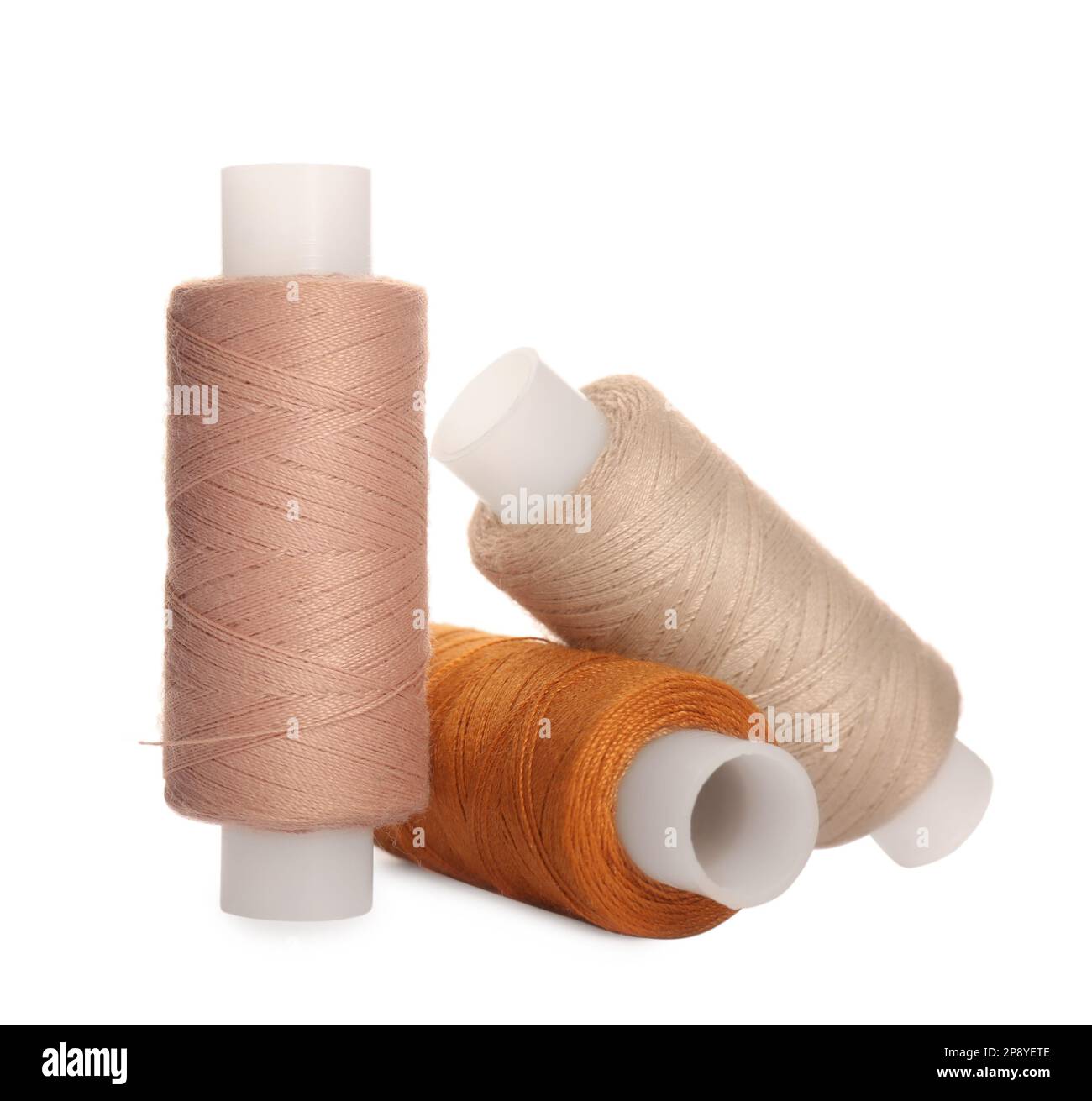 Different colorful sewing threads on white background Stock Photo - Alamy