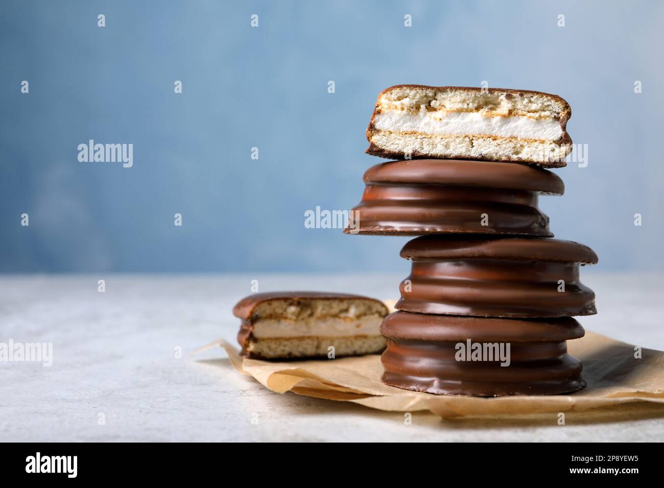 Stack of tasty choco pies on grey table. Space for text Stock Photo - Alamy