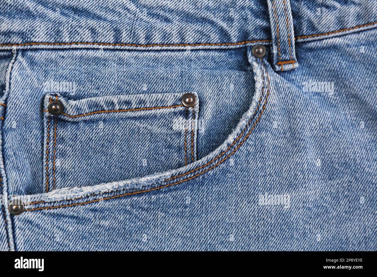 Light blue jeans with inset pocket as background, closeup Stock Photo ...