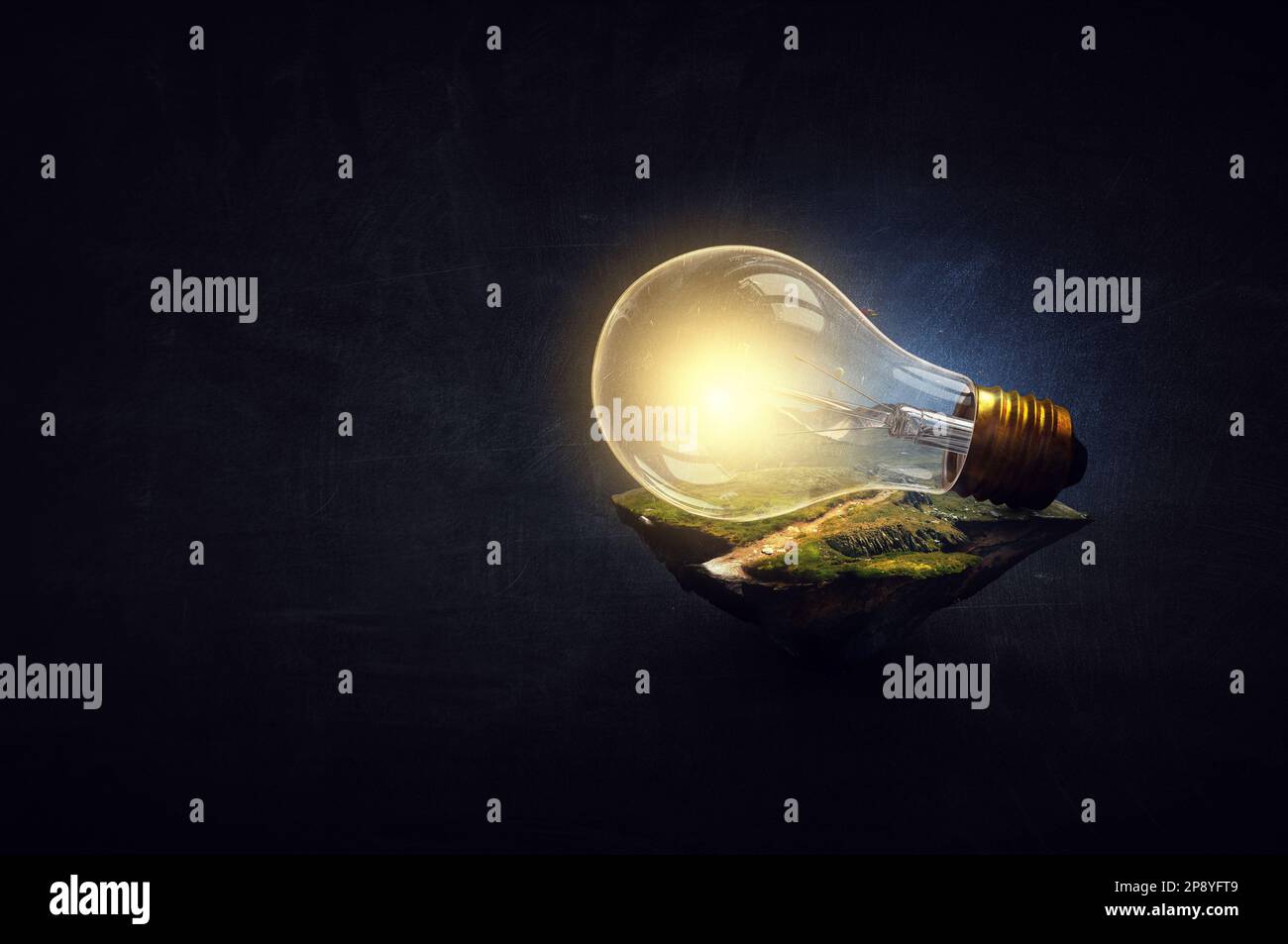 Huge light bulb glowing in the darkness Stock Photo - Alamy