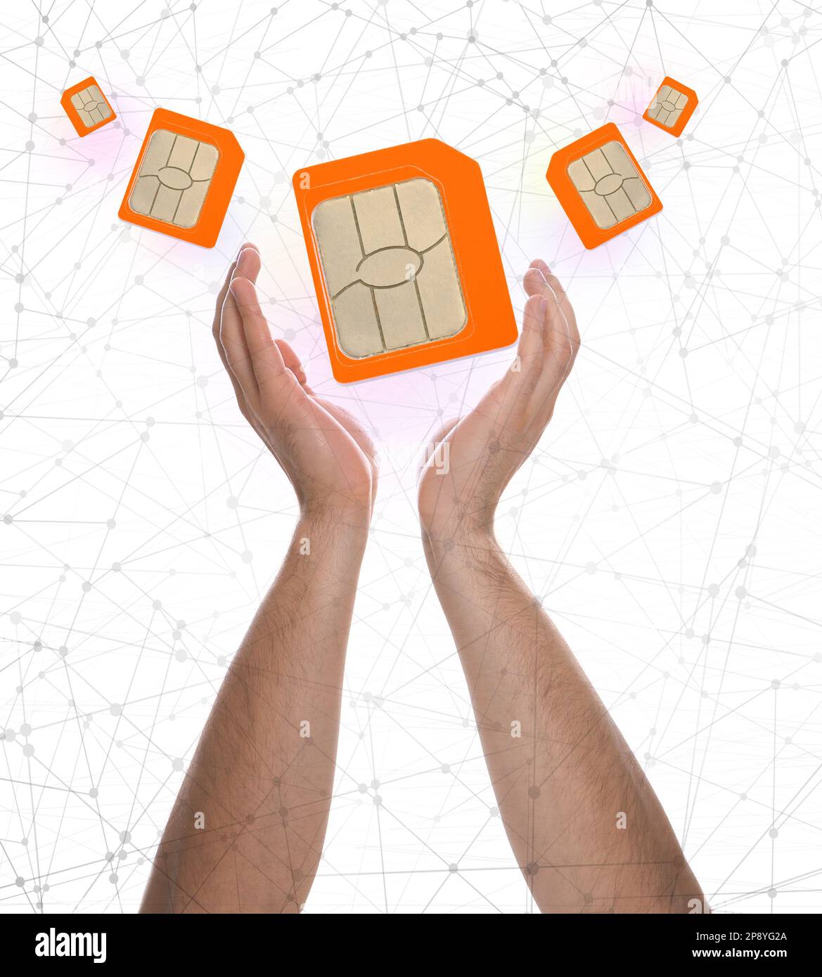 Man demonstrating SIM cards of different sizes on white background ...
