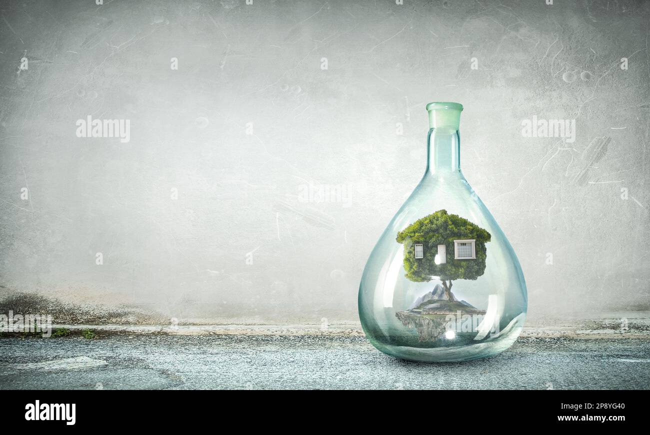 House inside a floating glass bottle Stock Photo - Alamy