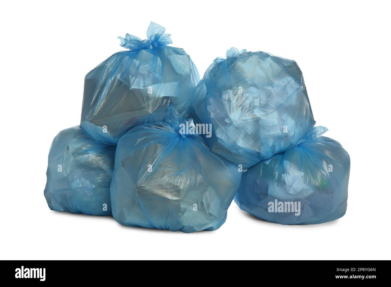 Blue trash bags filled with garbage on white background Stock Photo - Alamy