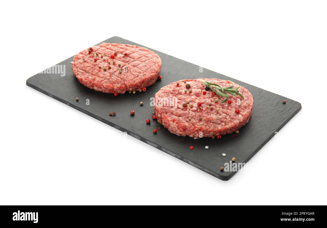 Raw hamburger patties with rosemary and spices on white background ...