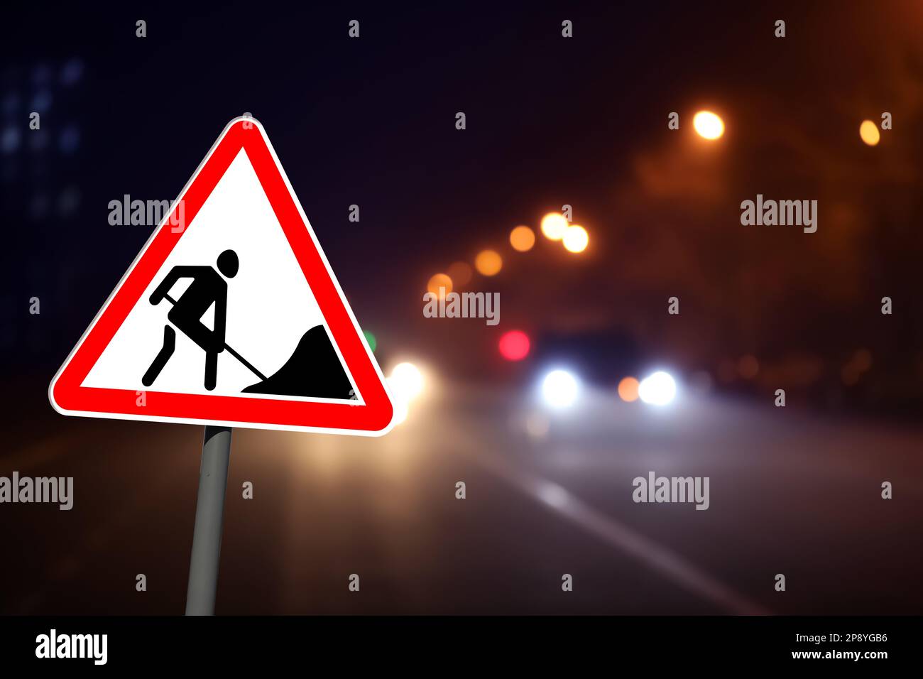 Traffic sign Road Works near highway in night. Bokeh effect Stock Photo ...