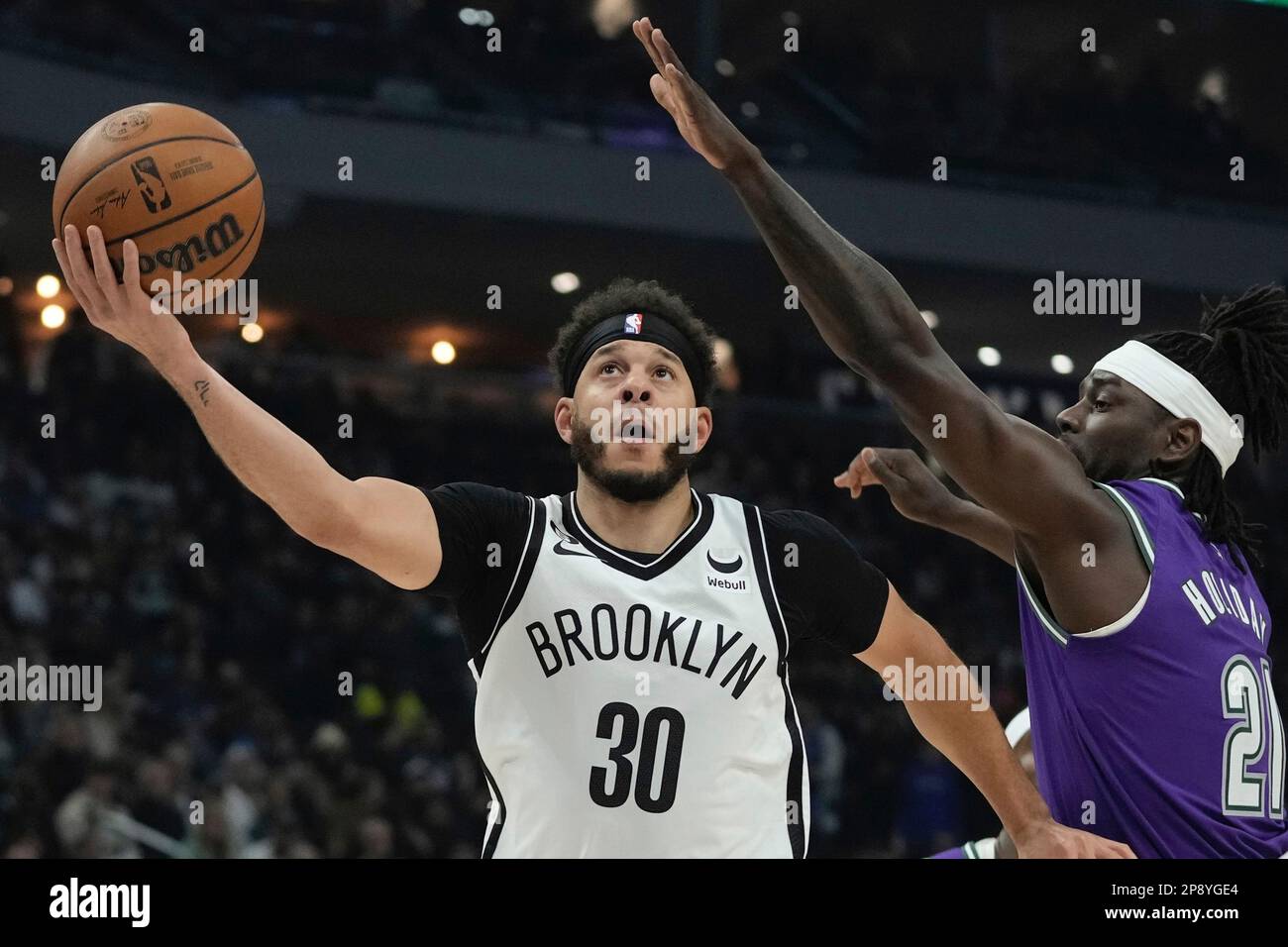 Brooklyn Nets' Seth Curry shoots past Milwaukee Bucks' Jrue Holiday ...
