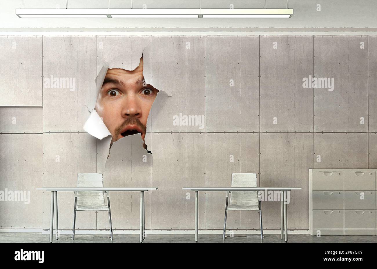 Male face through the hole in paper Stock Photo - Alamy