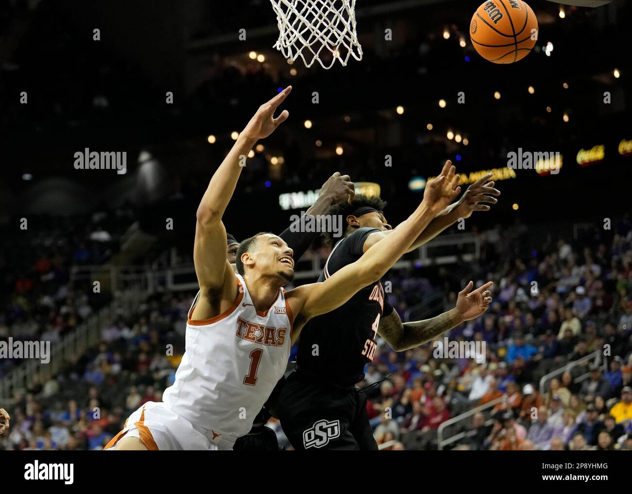 MAR 09 2023: Texas forward Dylan Disu (1) battles Oklahoma State guard ...