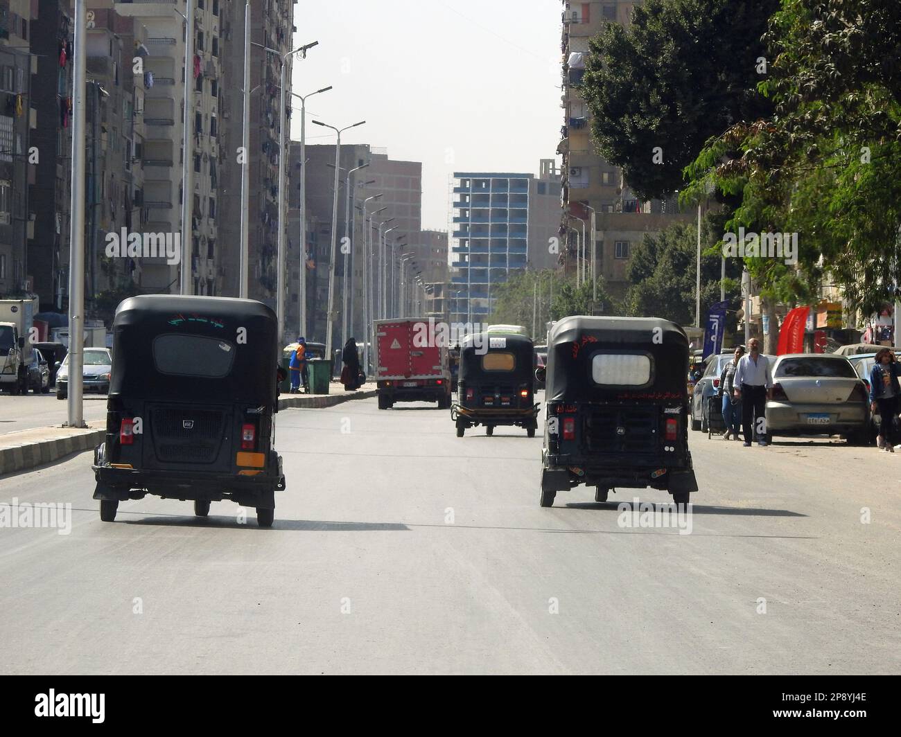 Cairo, Egypt, March 9 2023: auto rickshaw, baby taxi, mototaxi, pigeon ...