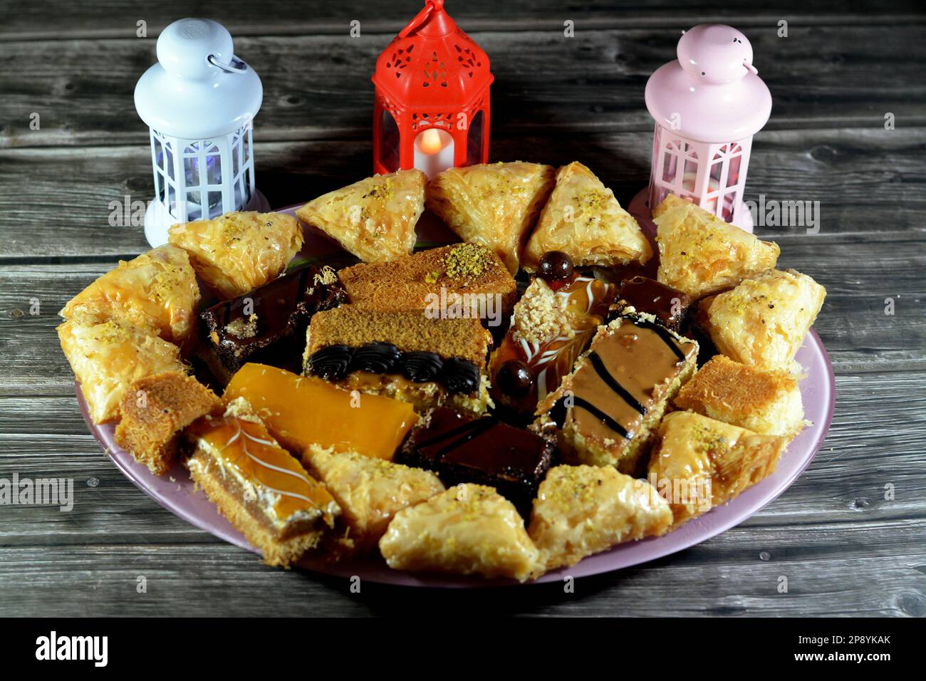 Eastern desserts with Ramadan lanterns, Konafa covered with mango ...