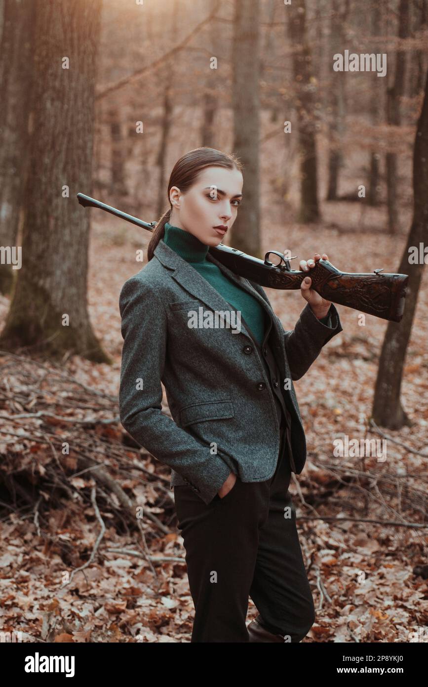 successful hunt. hunting sport. girl hunter in forest. girl with rifle ...