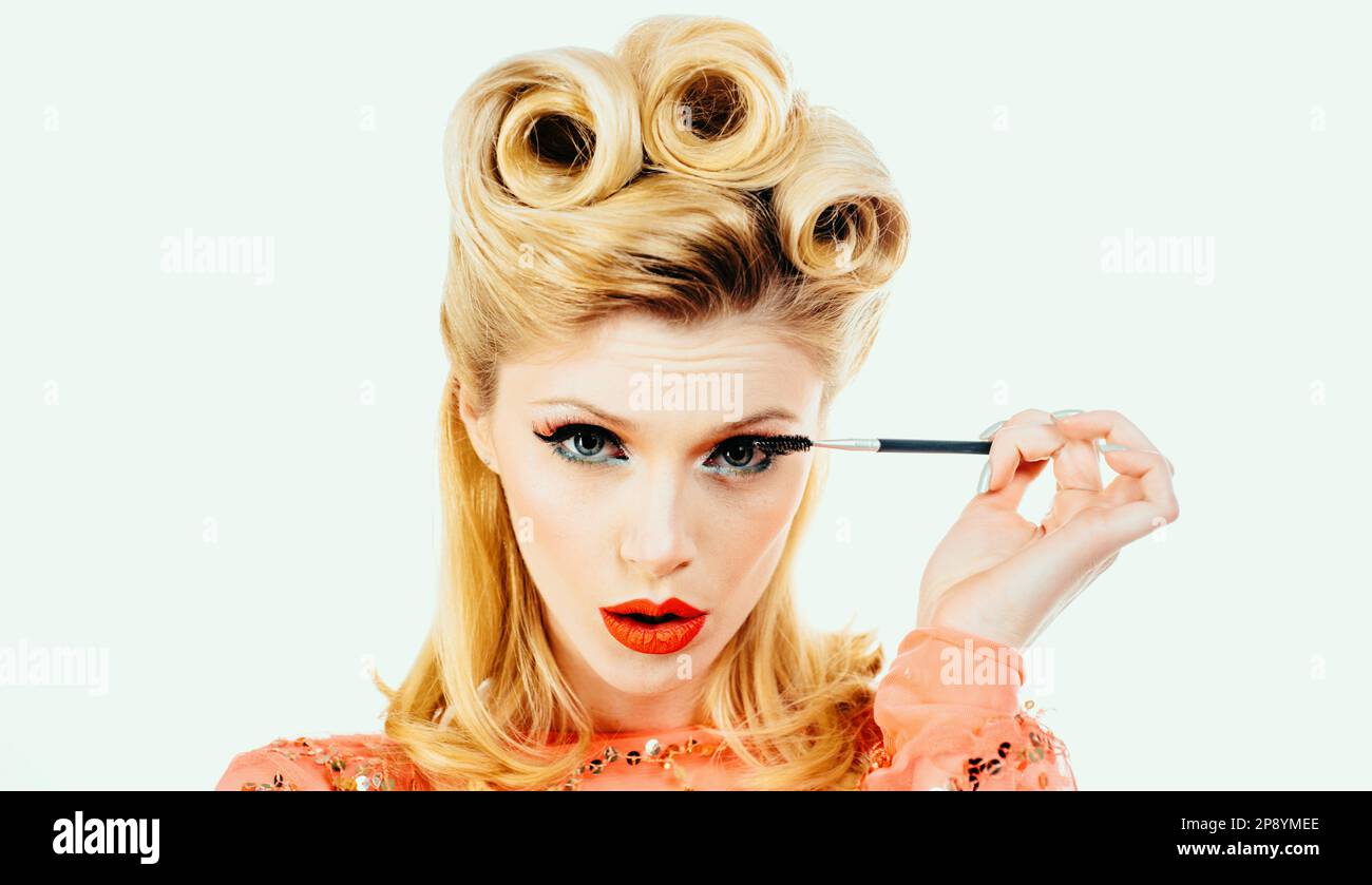 Eyebrow makeup. Beauty blonde model shaping brows with brow pencil ...